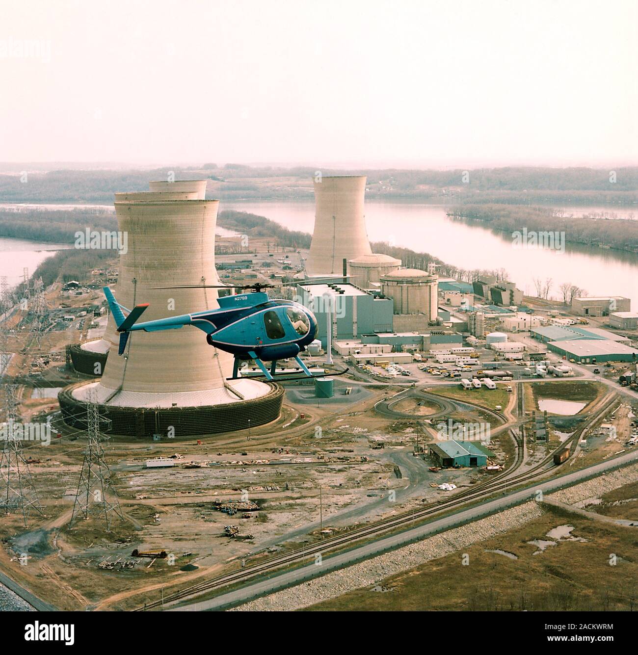 Three Mile Island incident. H-500 helicopter over Three Mile Island (TMI) nuclear power station ...