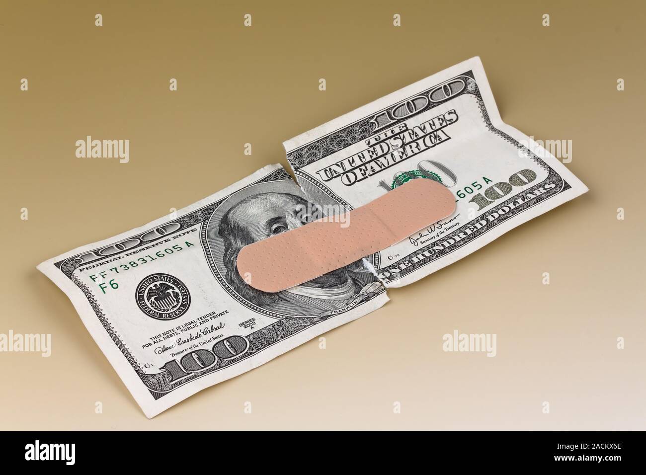 Dollar banknotes with a band-aid Stock Photo - Alamy