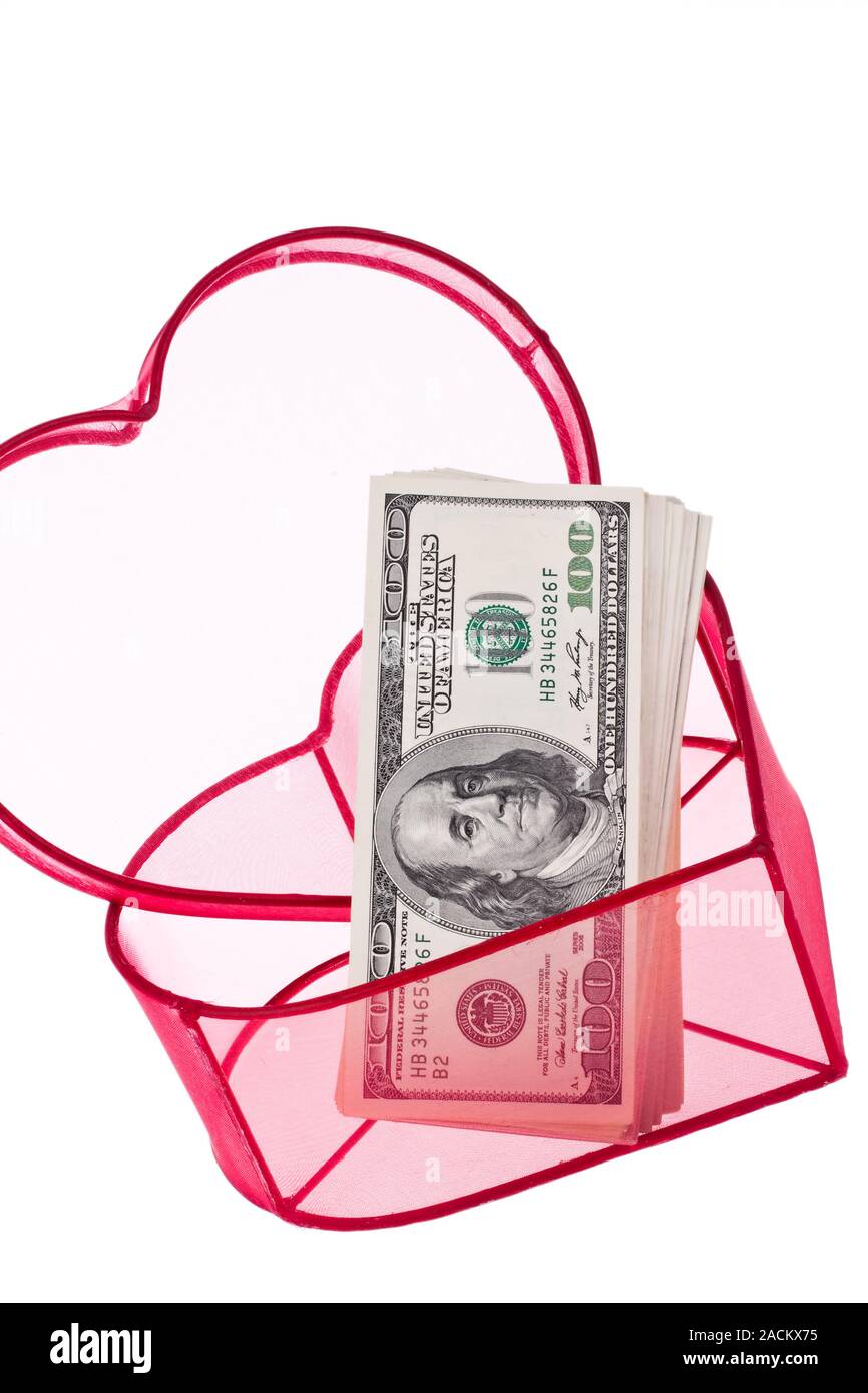 Dollar banknotes in a heart Stock Photo - Alamy