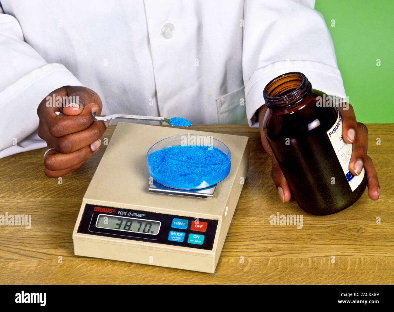 Weighing copper sulphate. Copper sulphate being weighed on a digital ...