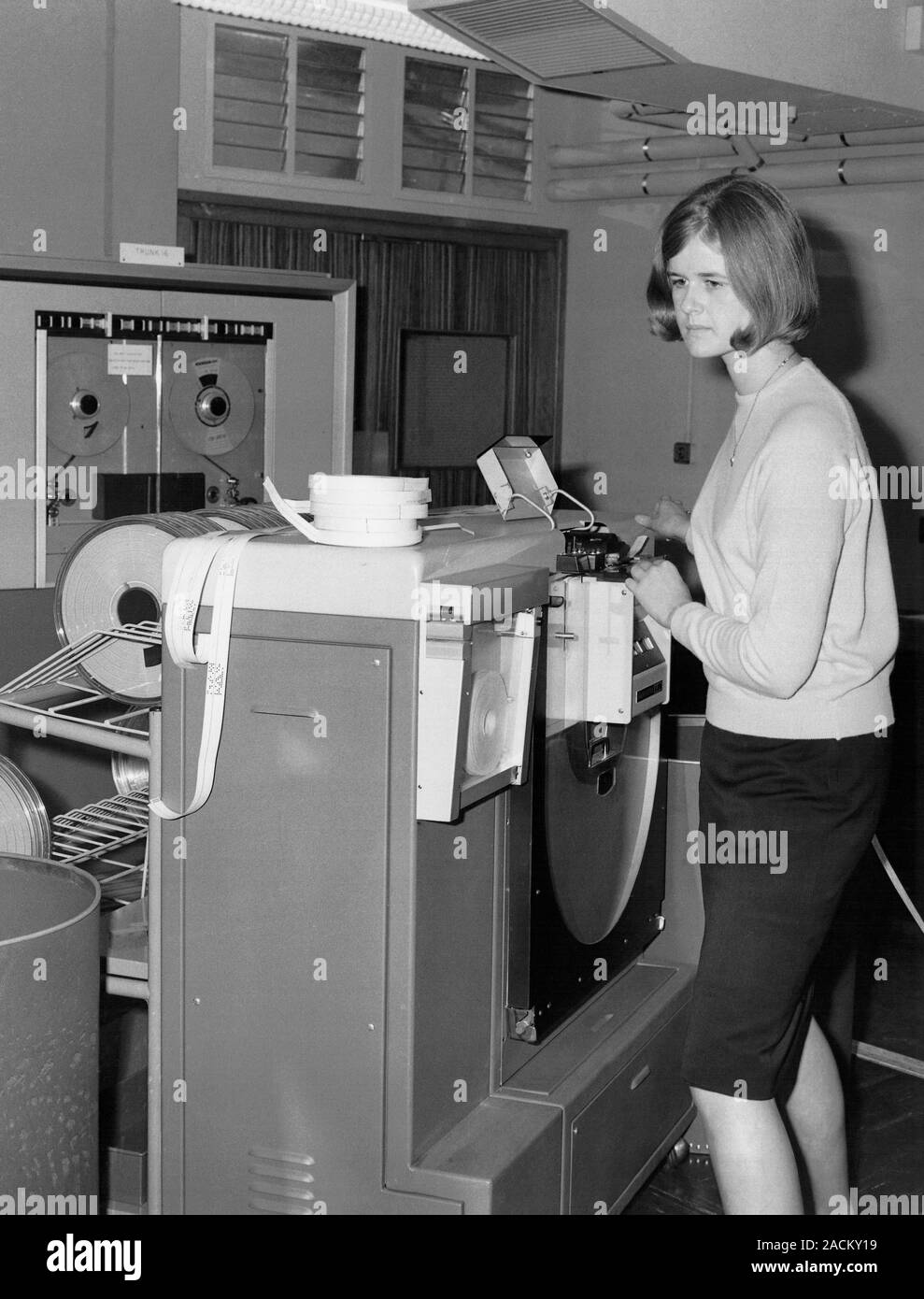Met Office Kdf9 Computer Computer Operative Handling One Of The Paper