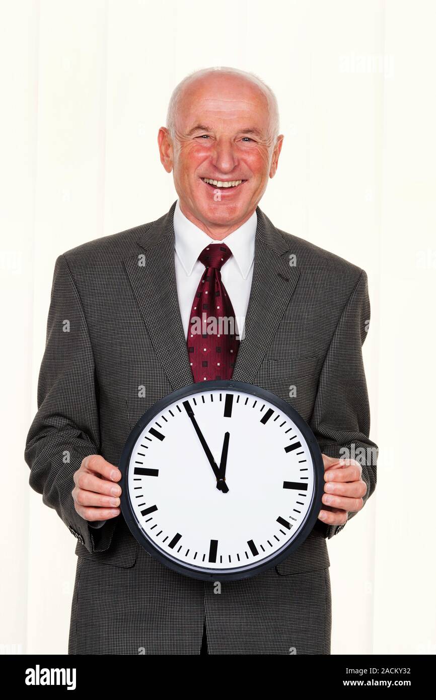Manager with clock 5 to 12 Stock Photo - Alamy
