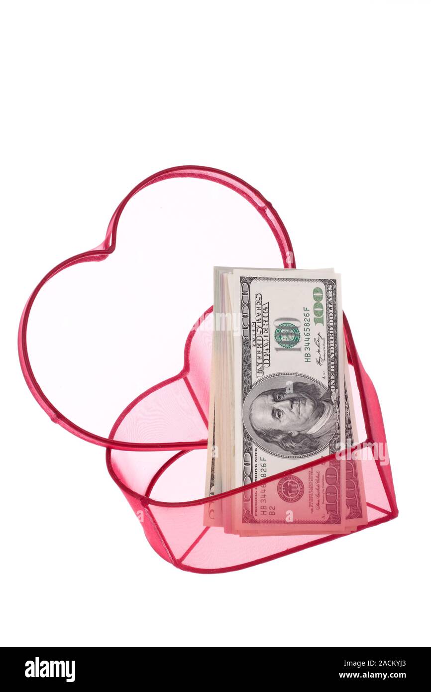 Dollar banknotes in a heart Stock Photo - Alamy