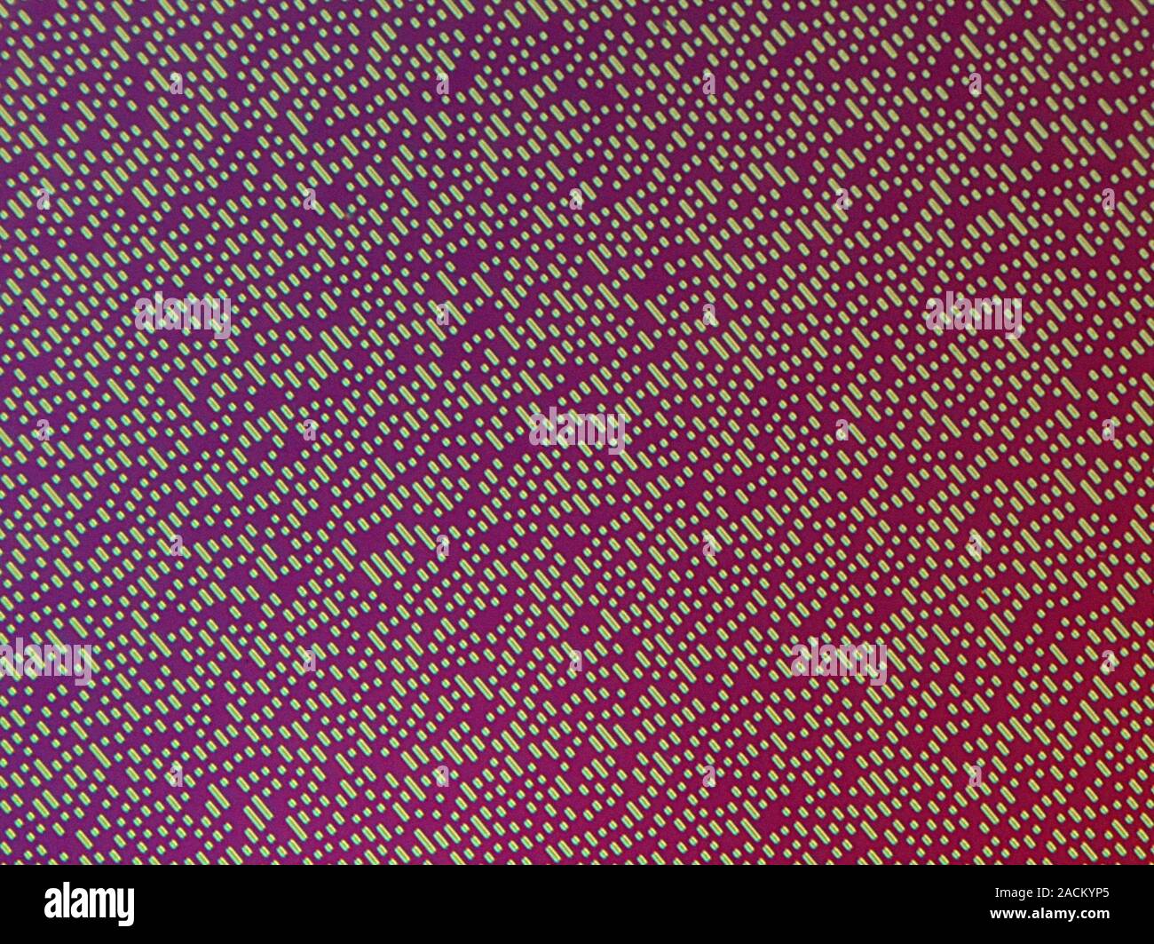 Compact disc surface. Light micrograph of the surface of a compact disc ...