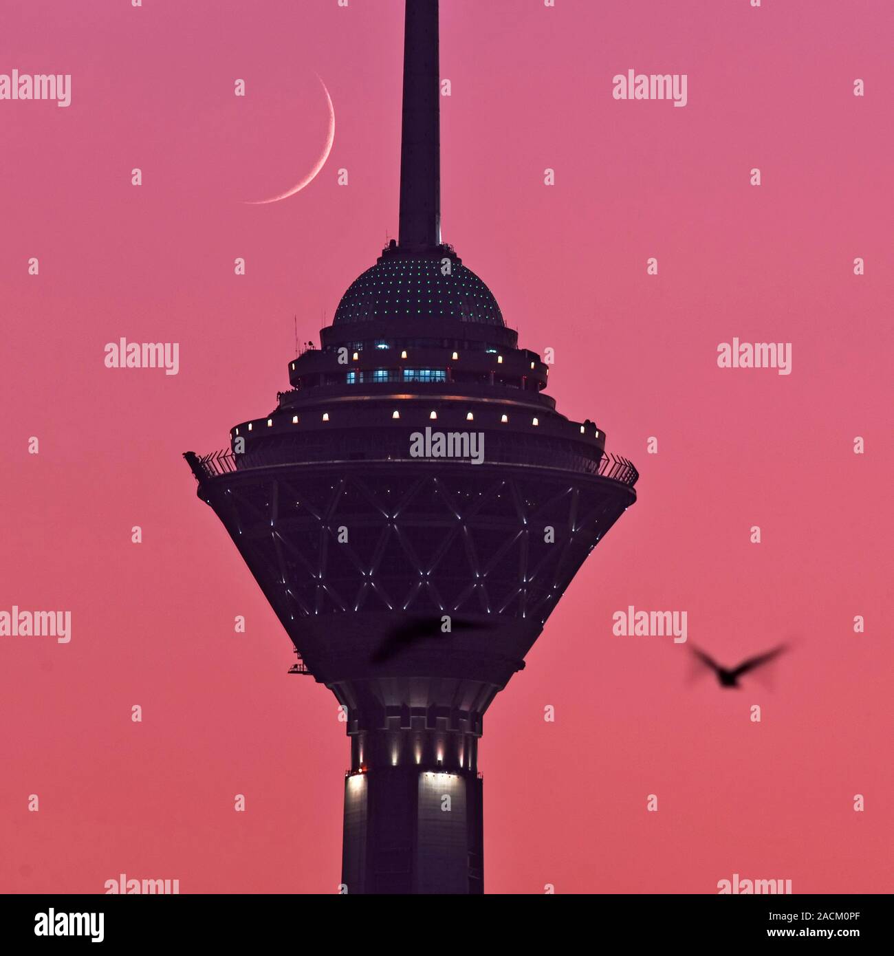 Crescent Moon behind Milad Tower, Tehran, Iran. This is the tallest ...