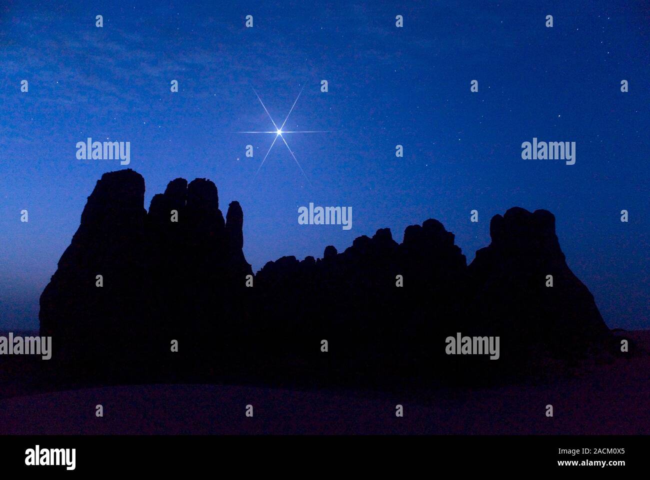 Venus above Saharan rocks. Venus (brightest object) rising above rock ...