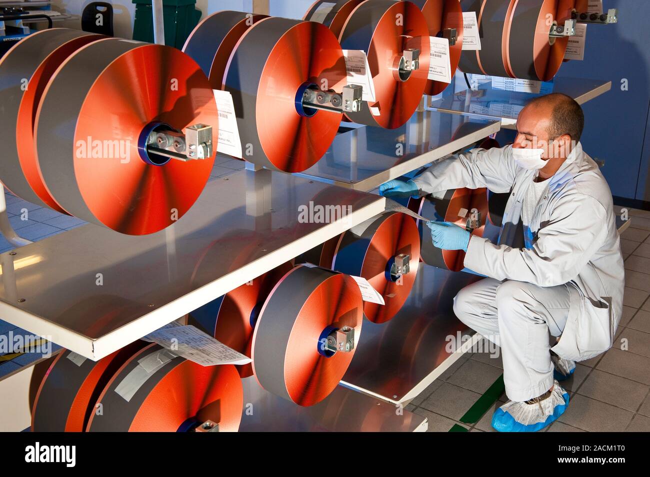 Electric car battery production. Rolls of metallic film with a mixture ...