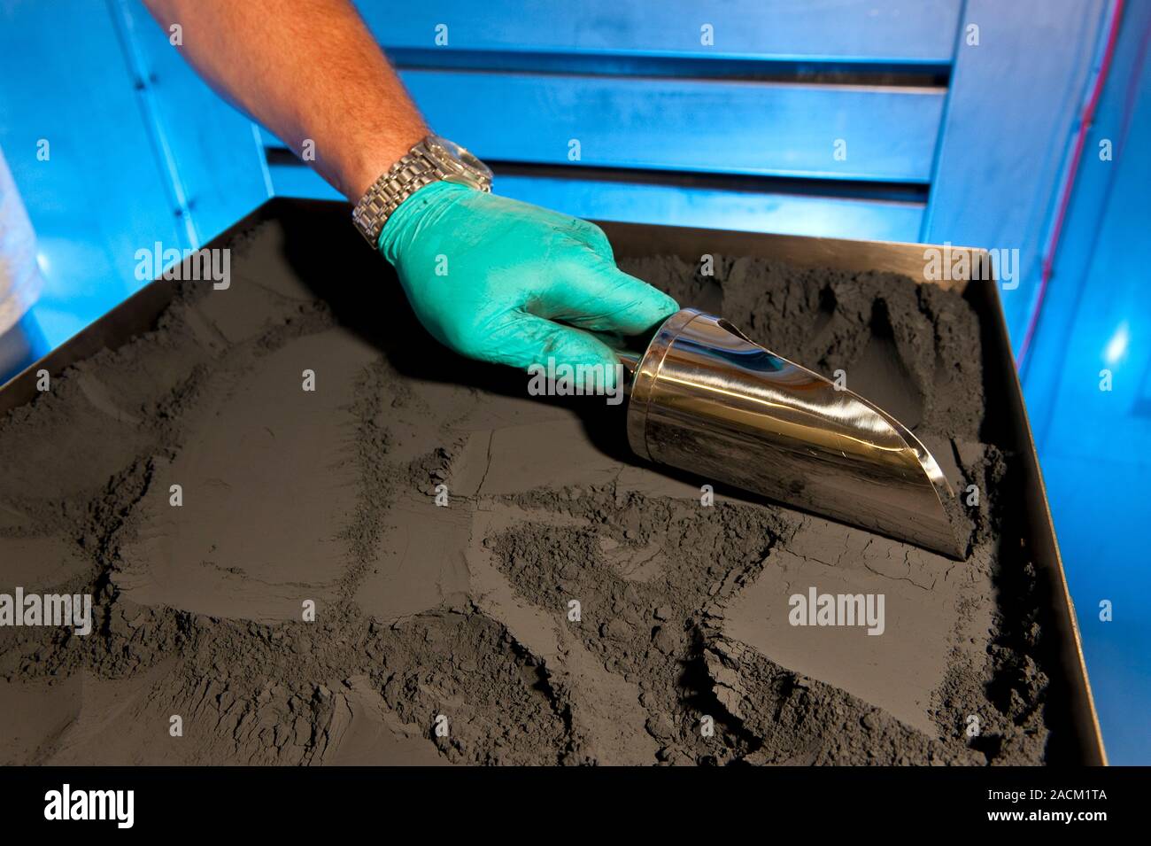 Electric car battery production. Technician mixing lithium and nickel ...