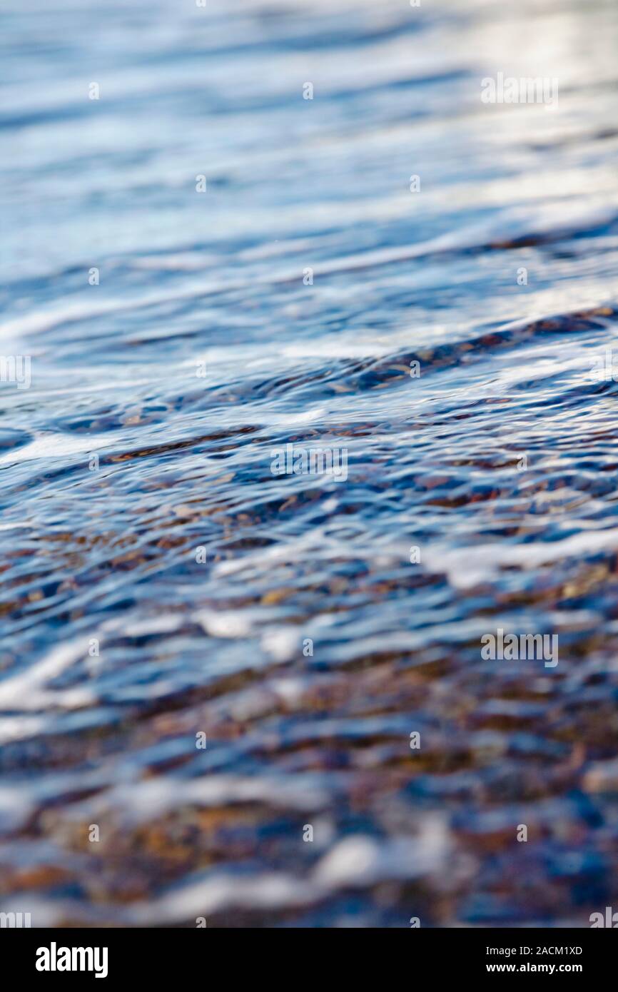 Undertow on a beach. The smooth water here consists of undertow, which ...