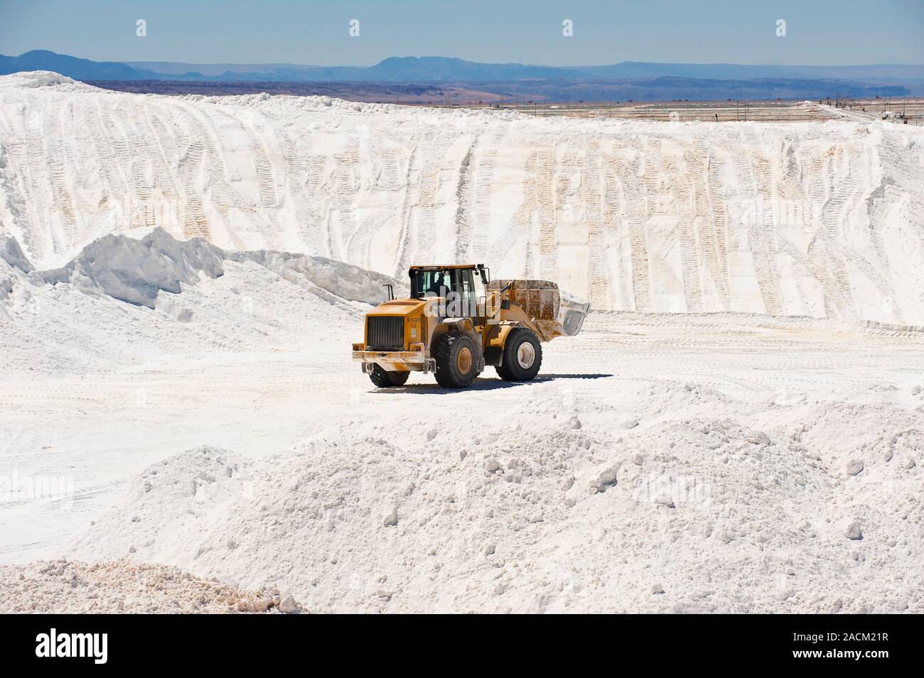 Lithium production. Digger loaded with lithium salts at a lithium ...