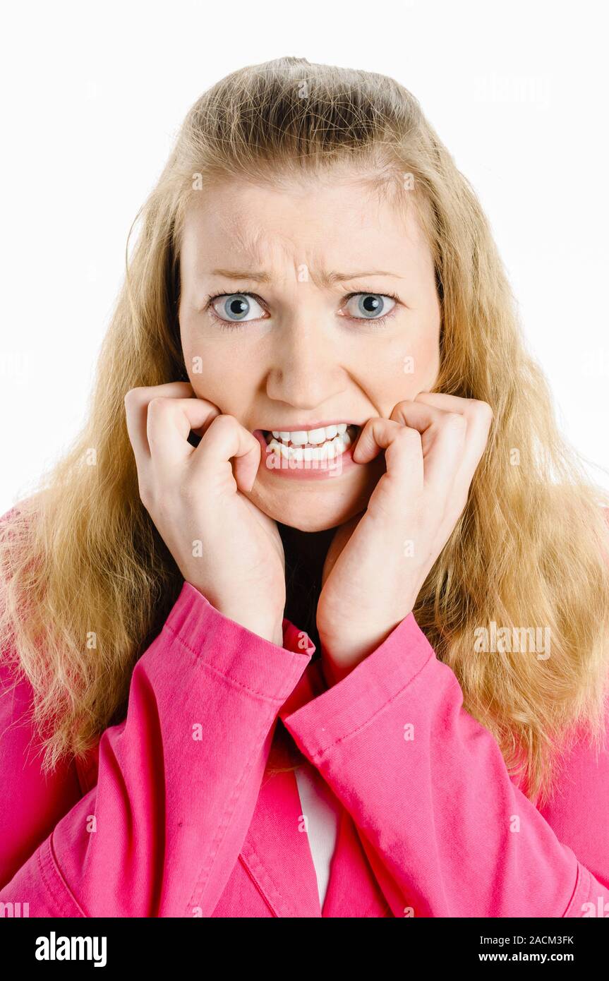 Young woman looks scared Stock Photo - Alamy