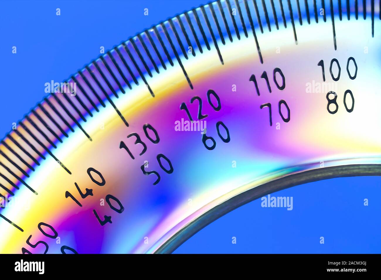 Photoelastic stress patterns of a protractor, viewed using polarised ...
