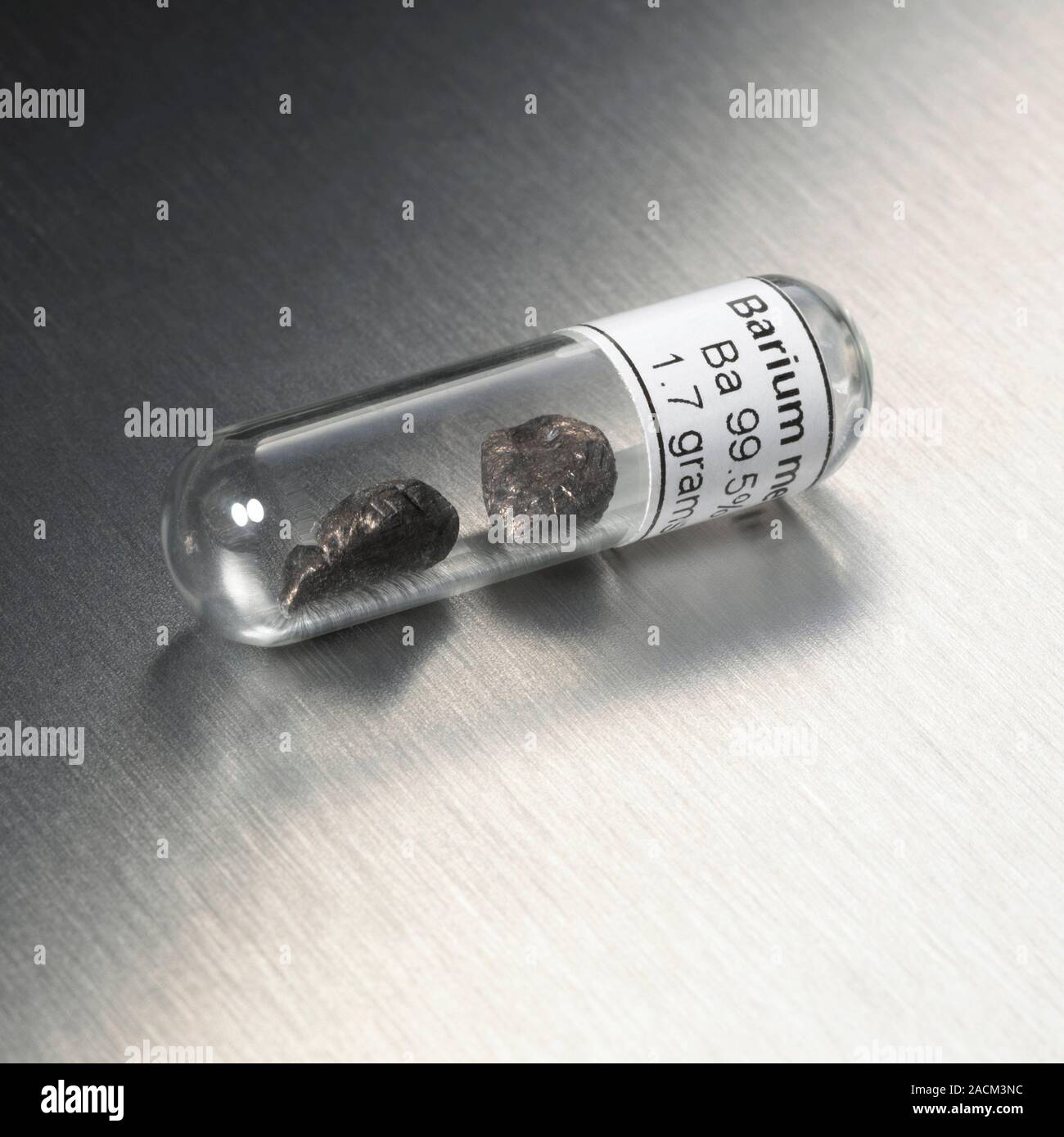 Barium. Vial containing a sample of the alkaline earth metal barium (Ba ...