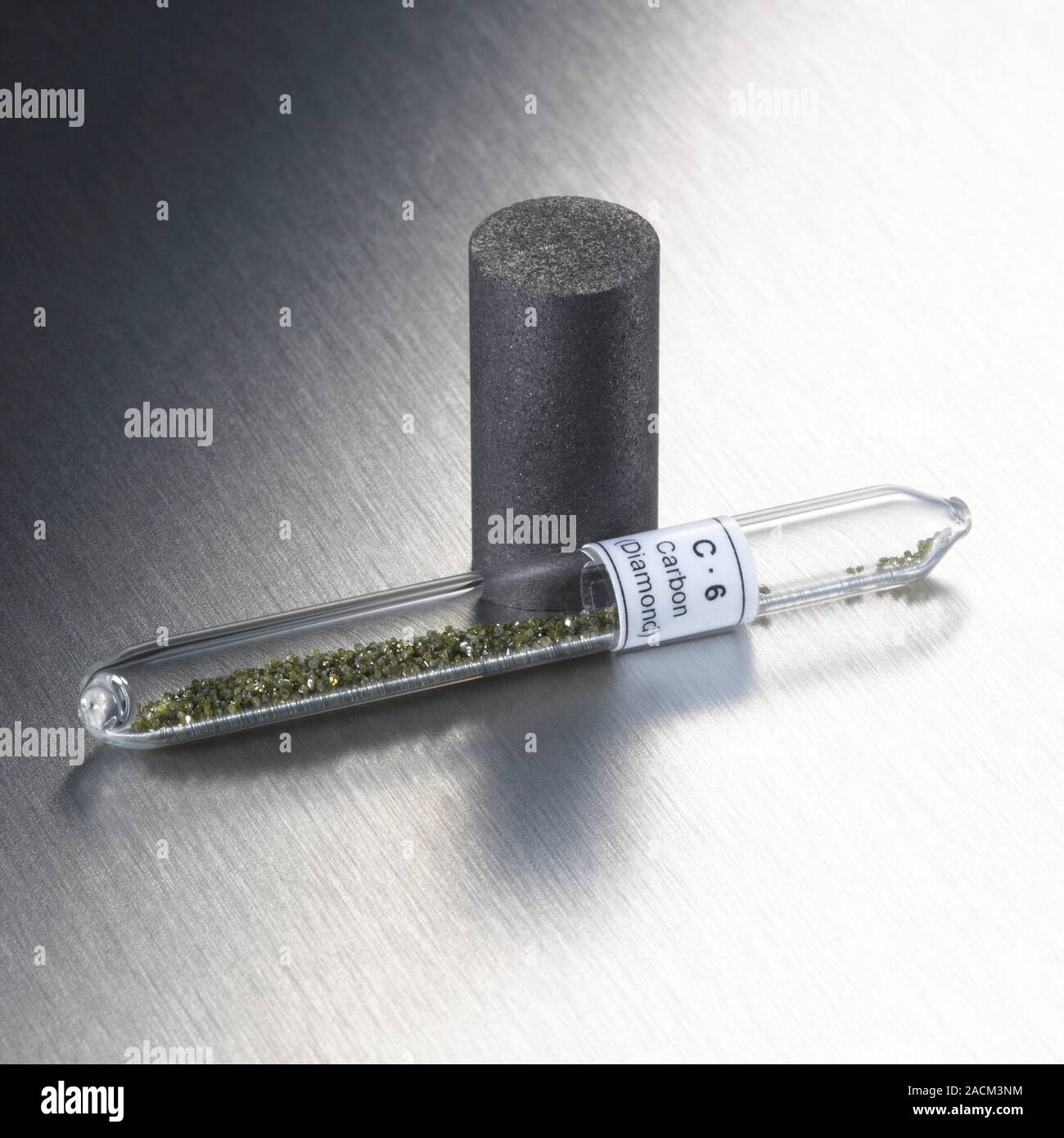 Carbon. Sample of carbon in two different forms, a graphite rod and ...
