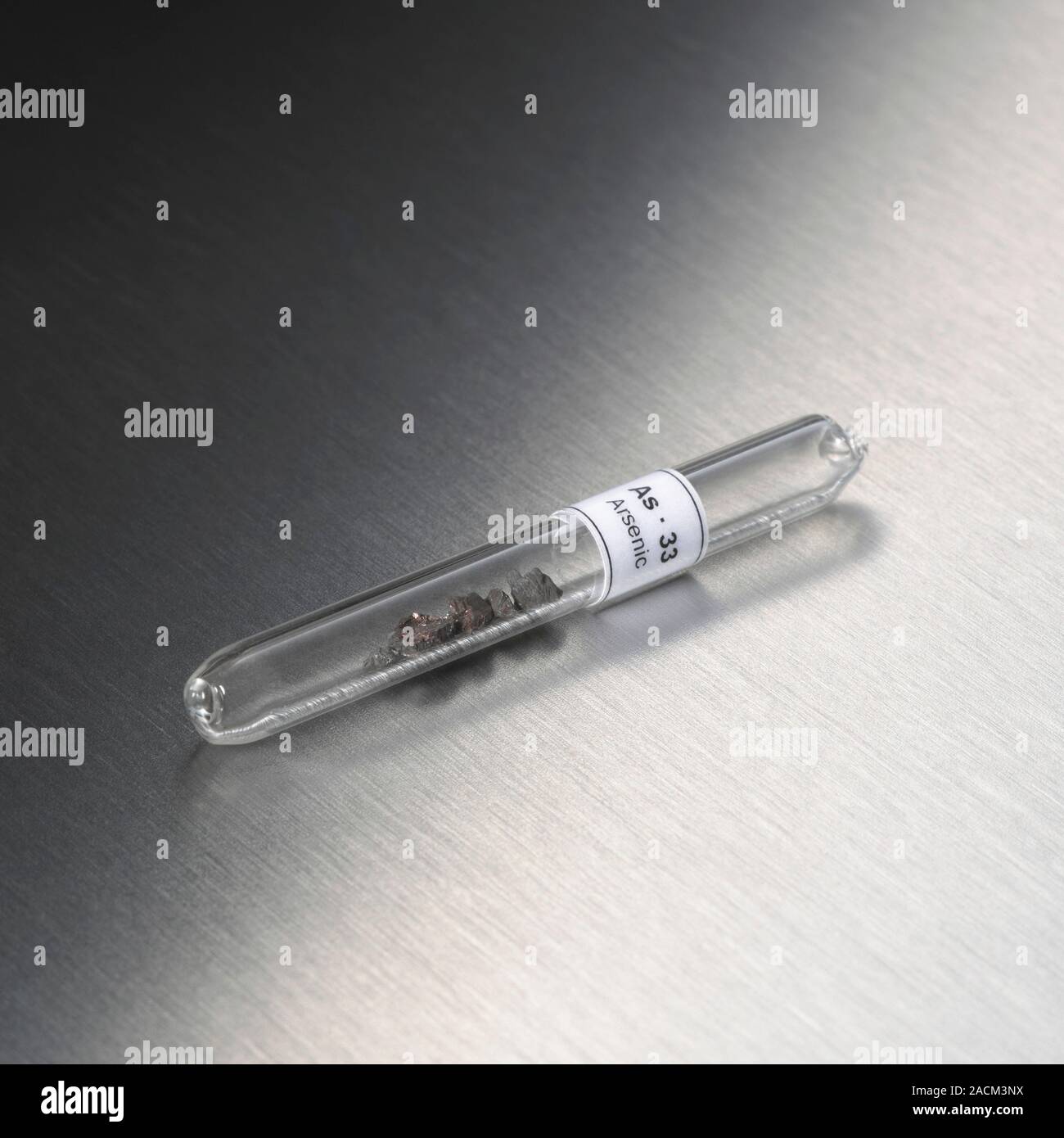 Arsenic. Vial containing a sample of the metalloid chemical element ...
