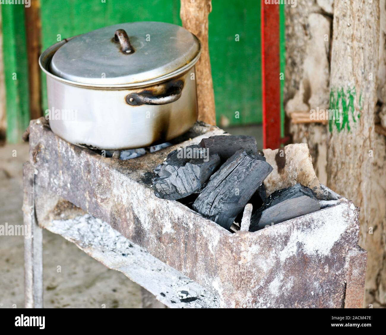 Charcoal stove. Food being cooked on a simple but efficient charcoal ...