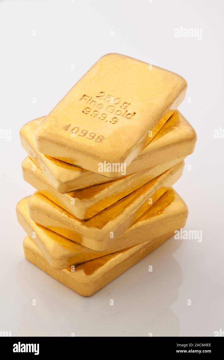 Investment in real gold as gold bars and goldm Stock Photo - Alamy