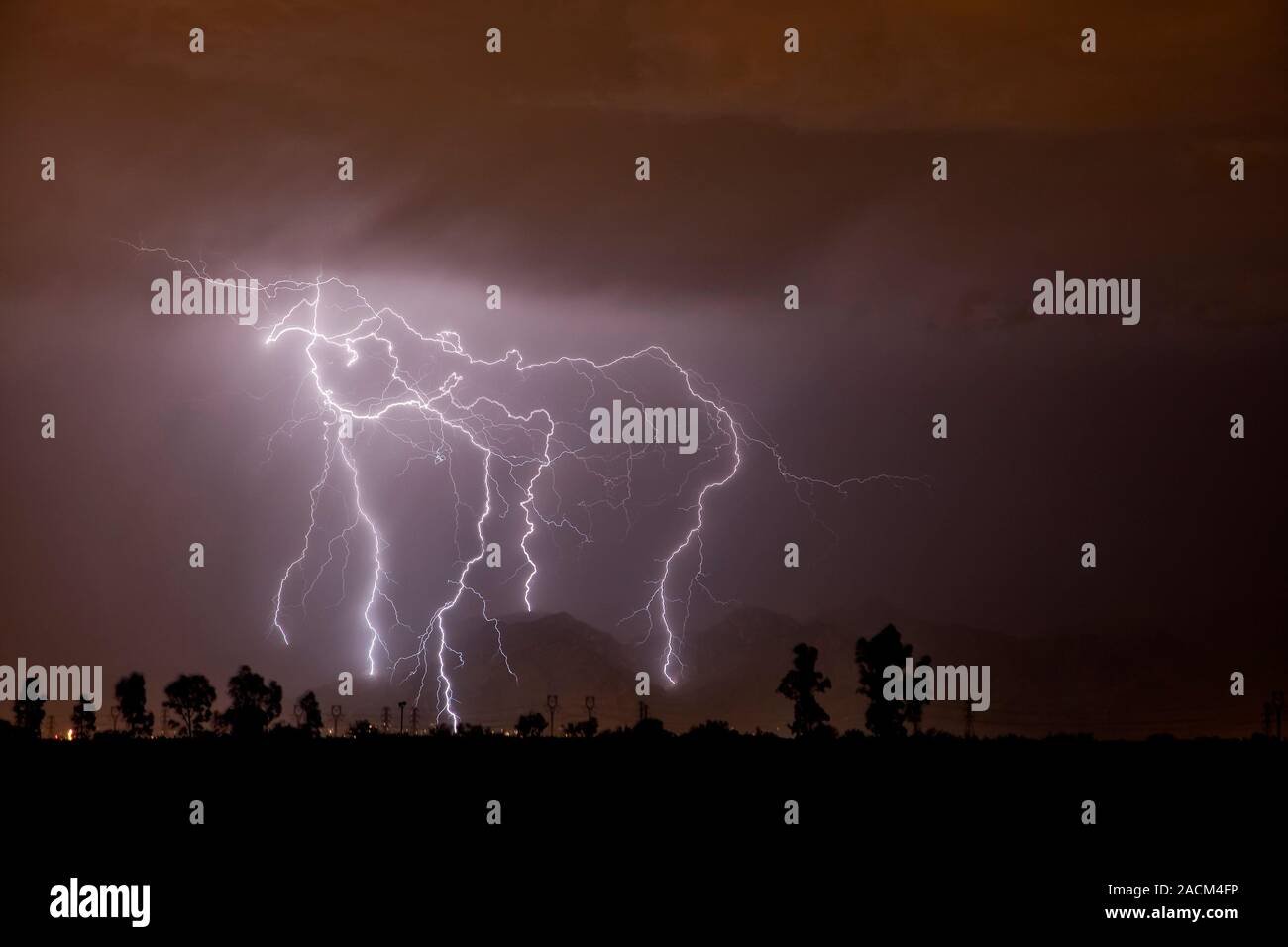Lightning. Time-exposure image of lightning strikes at night during a ...