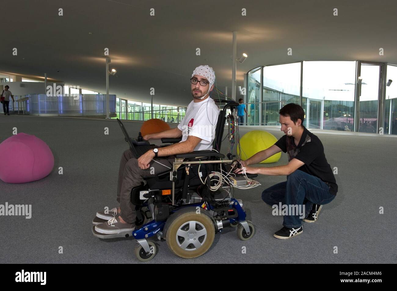 Thought-controlled wheelchair. Researchers testing a brain-machine ...