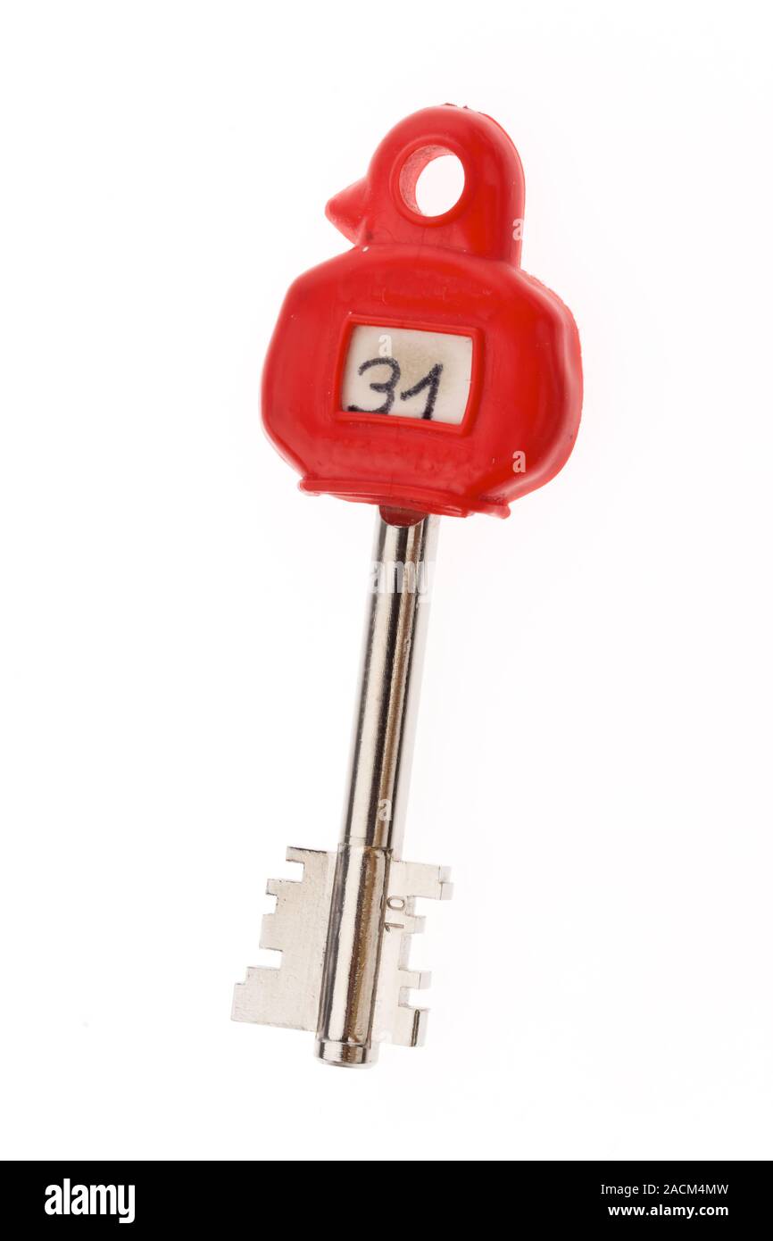 Key of a safe on white background Stock Photo - Alamy