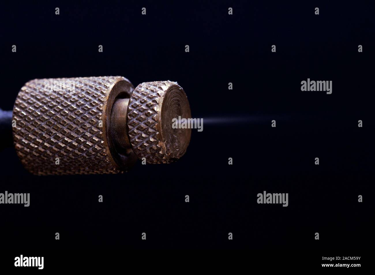 Liquid nitrogen cryotherapy nozzle attached to a flask that uses the ...