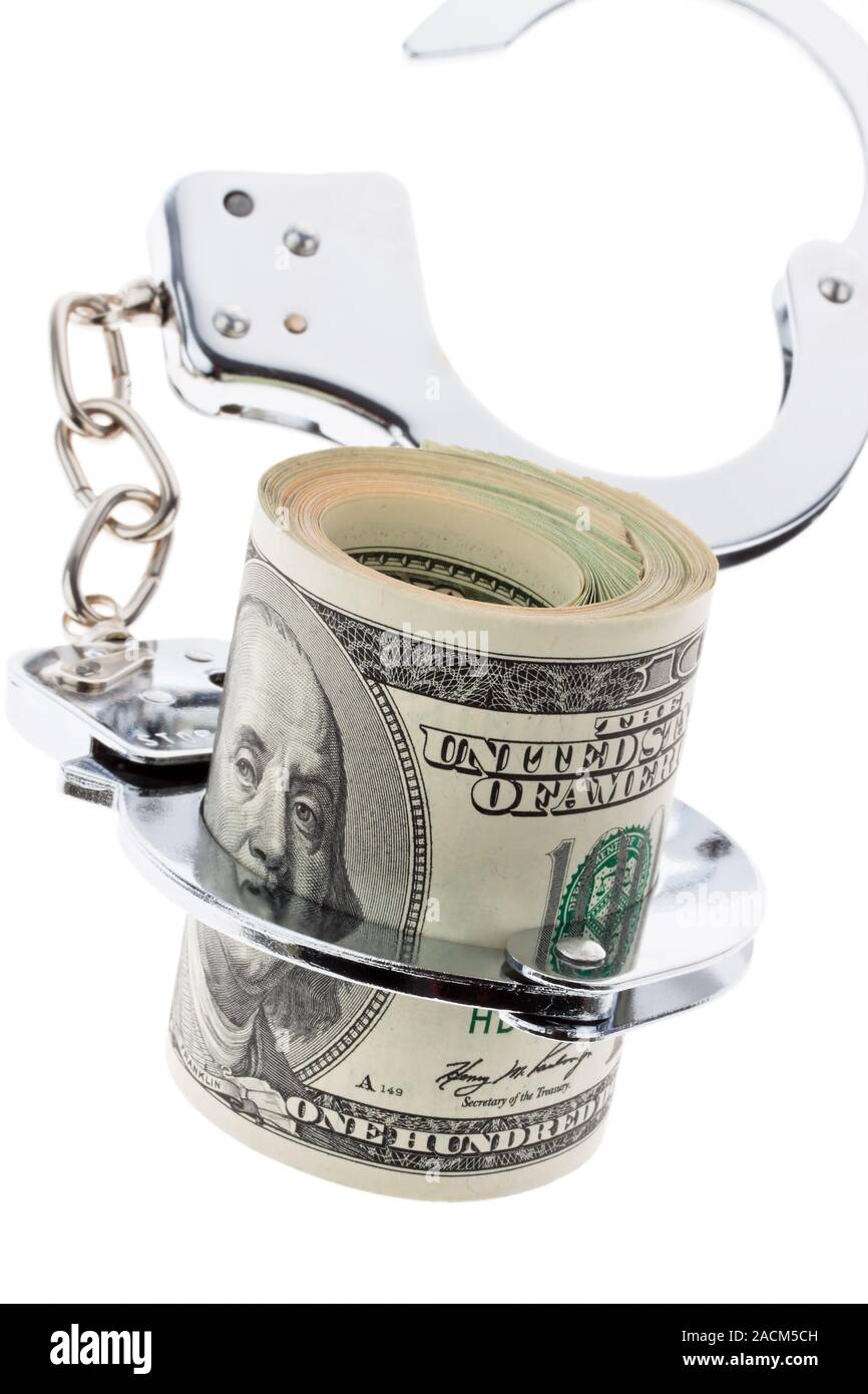 Dollar banknotes with handcuffs Stock Photo - Alamy