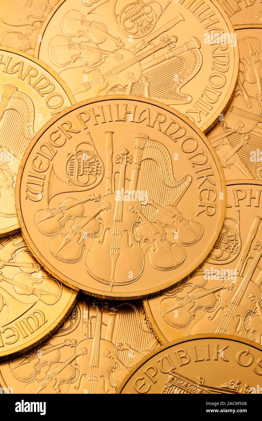 Investment in real gold as gold bars and goldm Stock Photo - Alamy