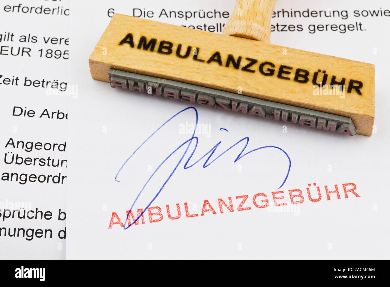 Wooden stamp on document: Ambulance fee Stock Photo - Alamy