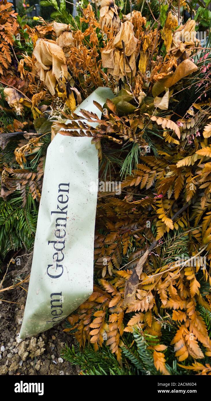 Withered wreath after a funeral Stock Photo - Alamy