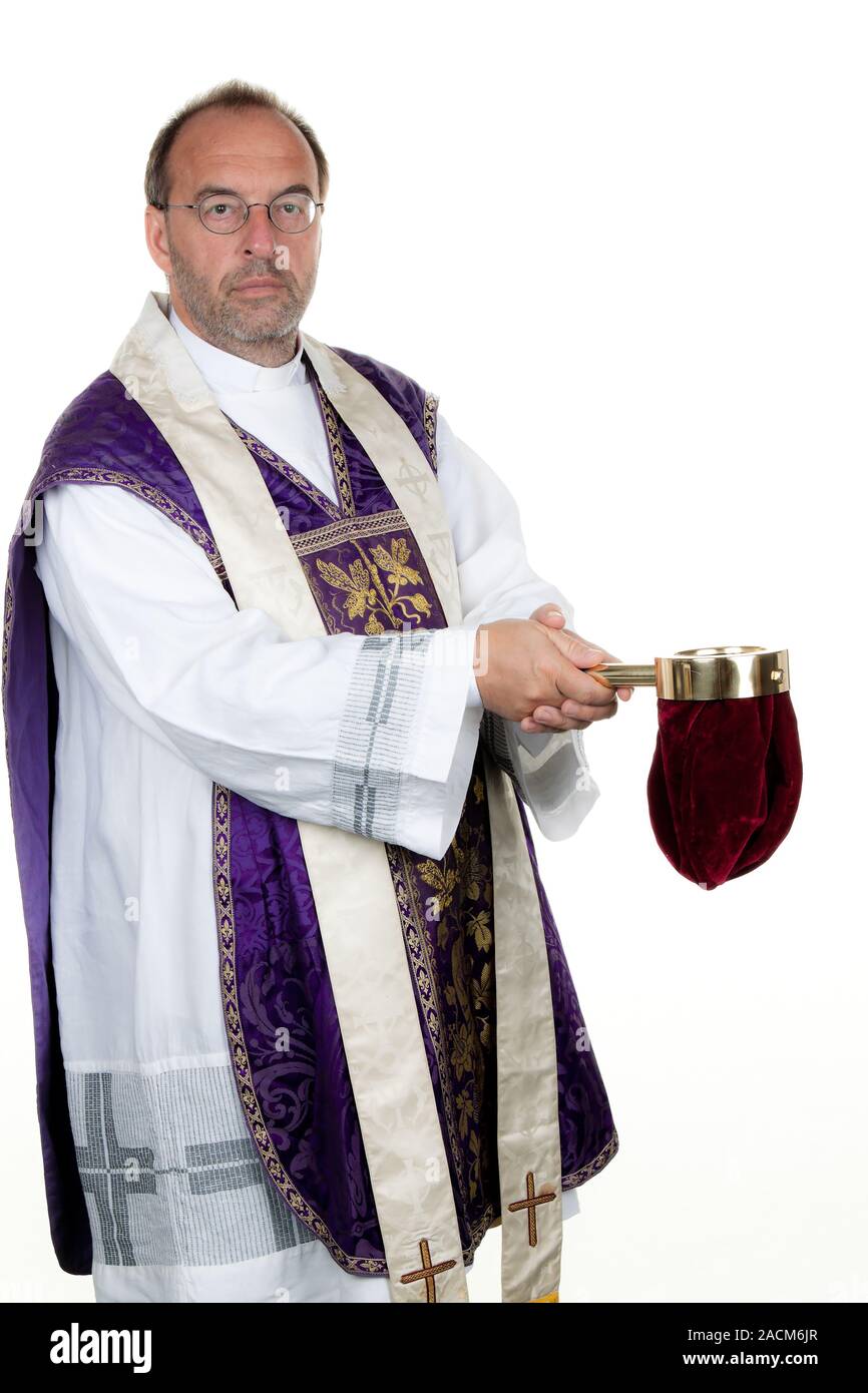 Catholic priest collects money for the church Stock Photo - Alamy