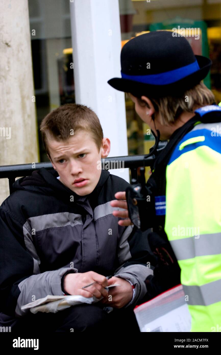 Community policing. Police community support officer (PCSO) talking to ...