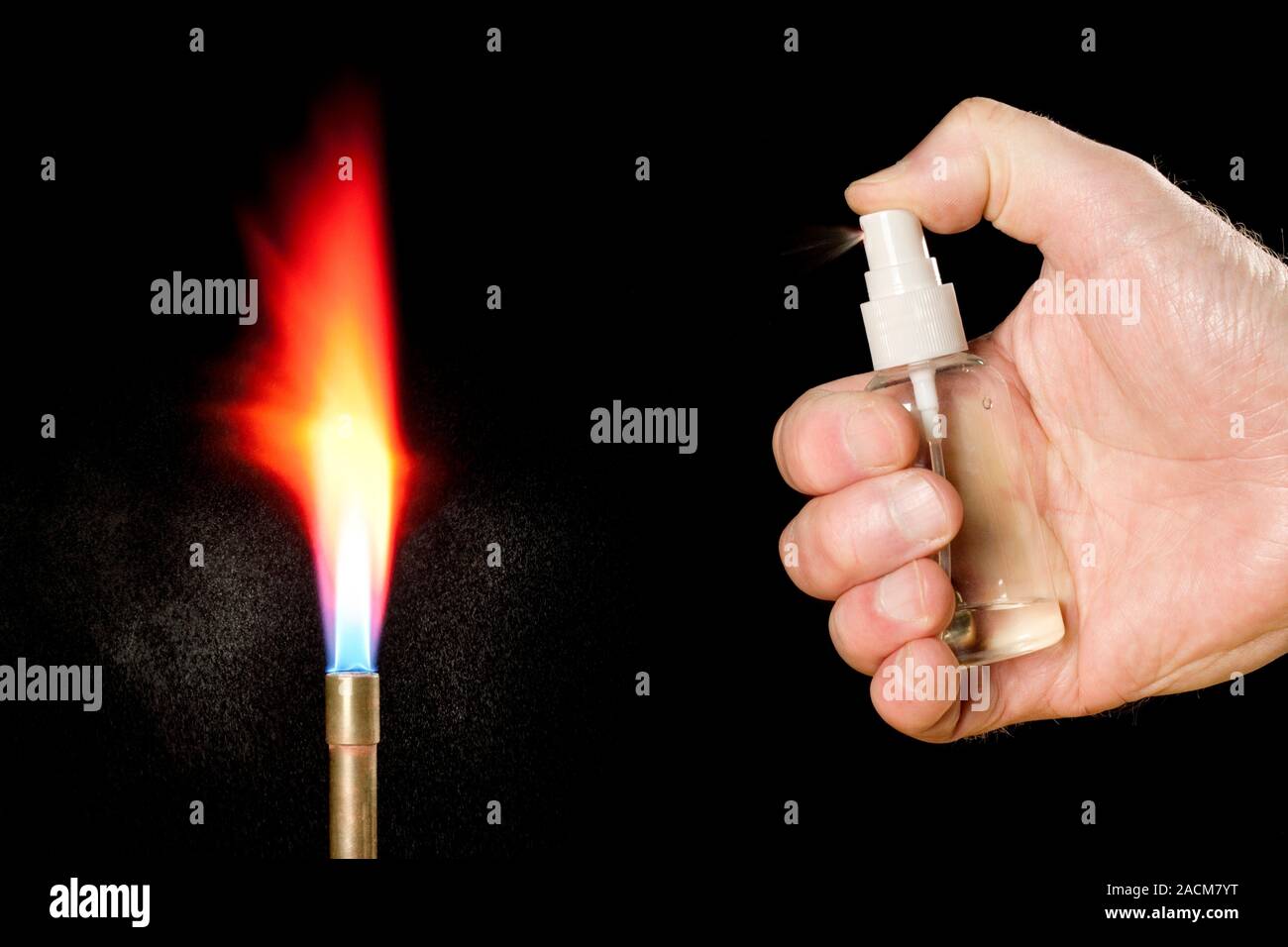 Lithium flame test. Metal salt being sprayed in mist form into a bunsen ...