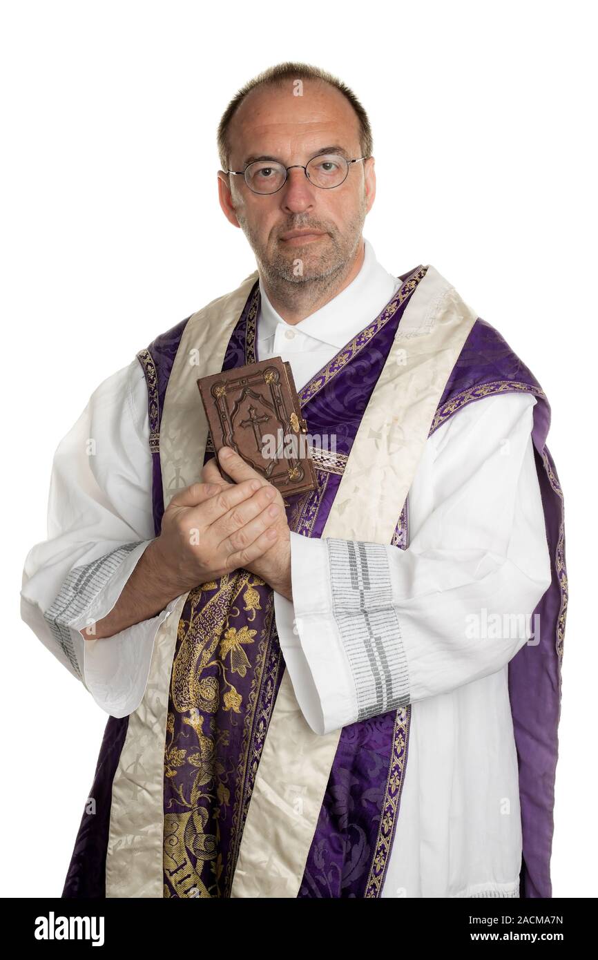catholic priest with bible in church service Stock Photo - Alamy