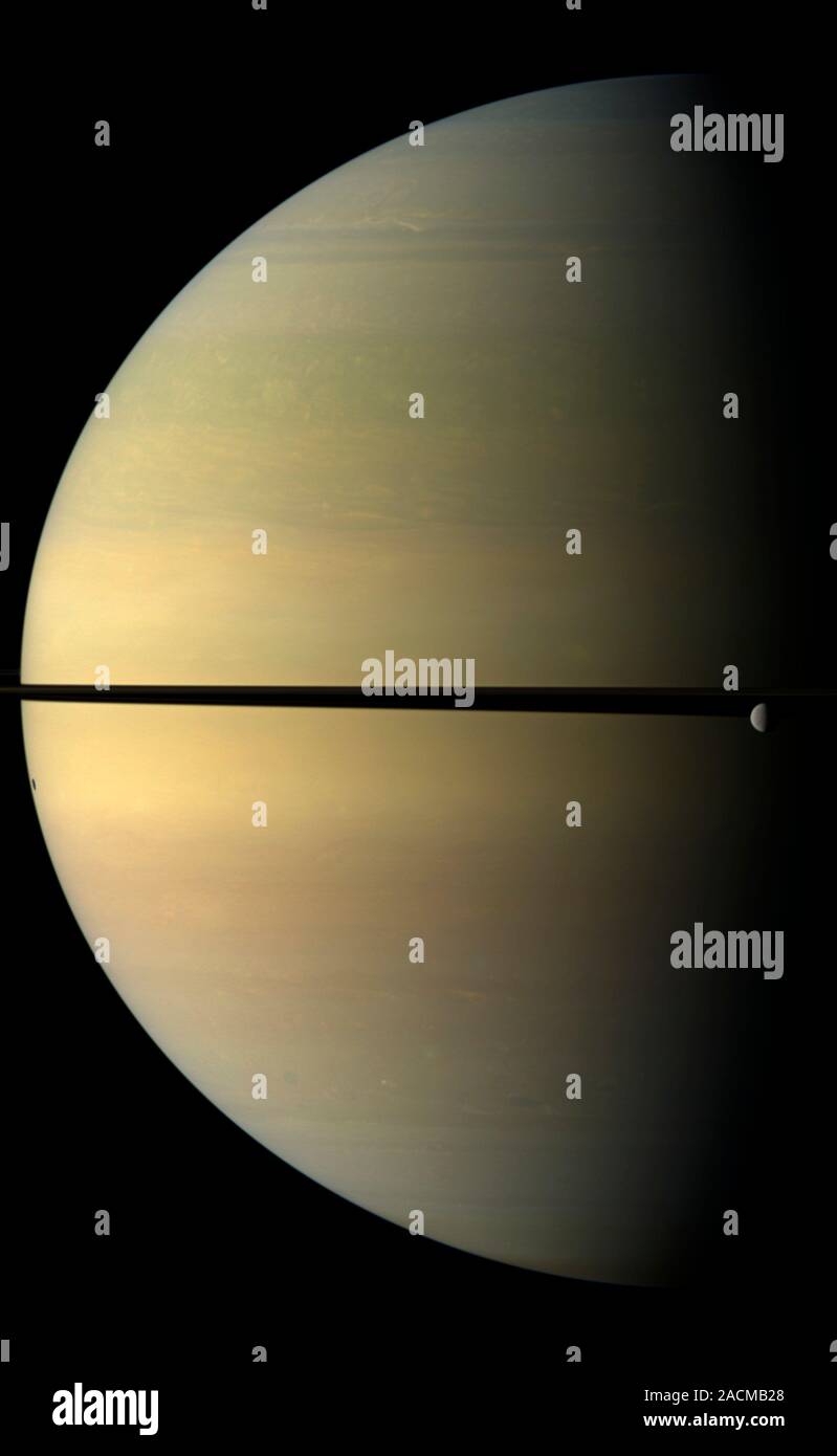 Saturn and Rhea, Cassini image. Saturn, a gas giant planet with an ...
