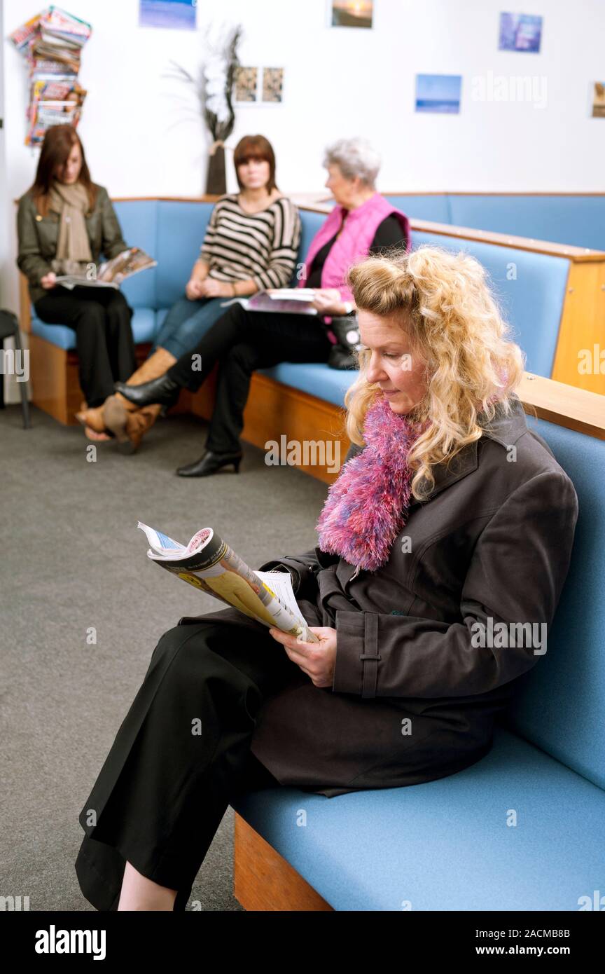 Waiting room. Woman reading a magazine in a waiting room Stock Photo ...