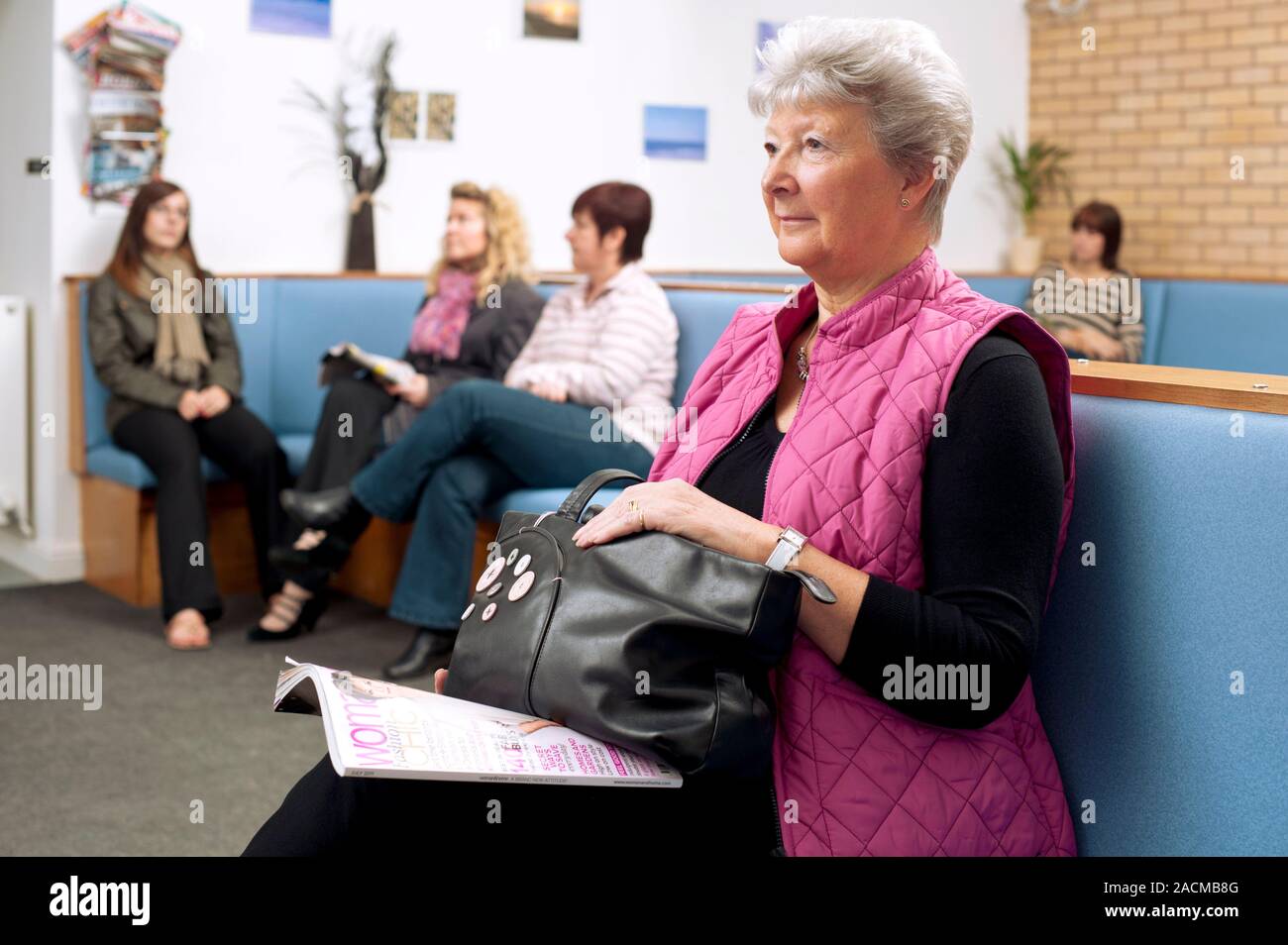 Waiting room. Older woman sitting in a waiting room Stock Photo - Alamy