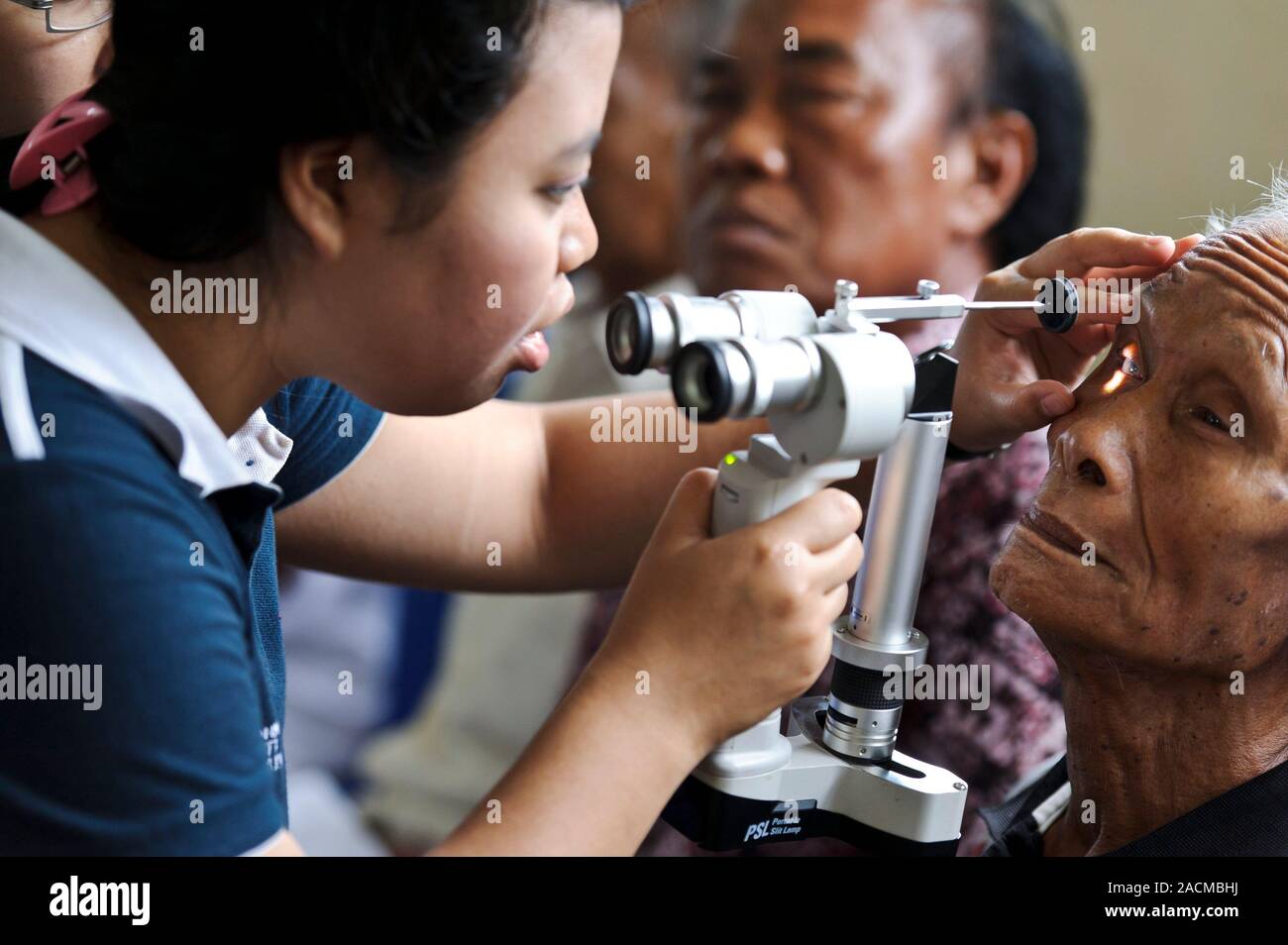 Eye clinic. Cataract surgery patient having his eye checked the day ...