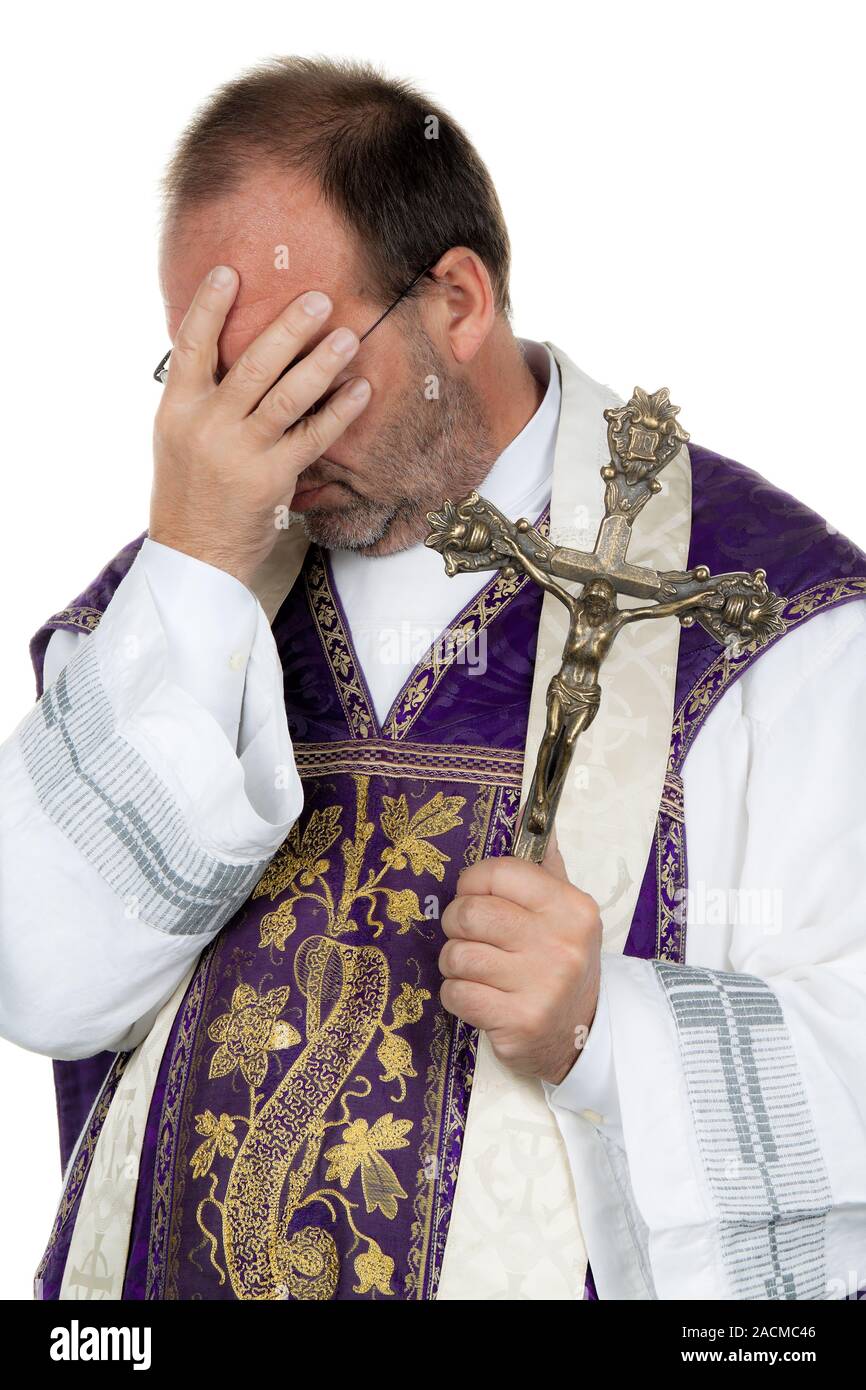 Catholic priest desperate Stock Photo - Alamy