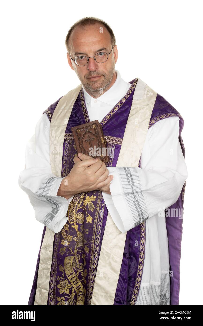 catholic priest with bible in church service Stock Photo - Alamy