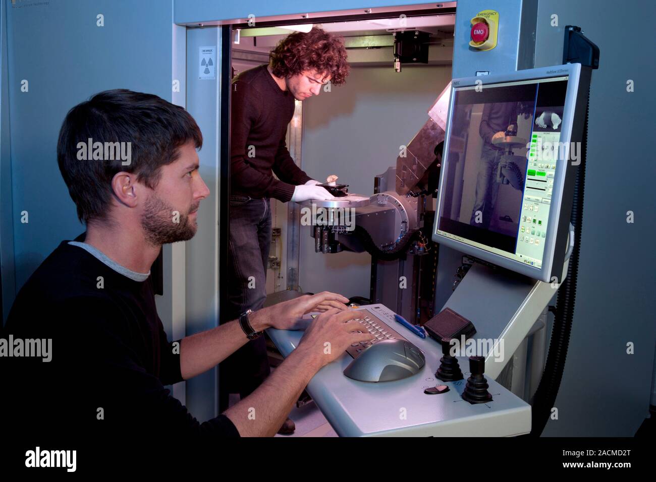 Fossil microtomography scanning. Researchers using microtomography ...