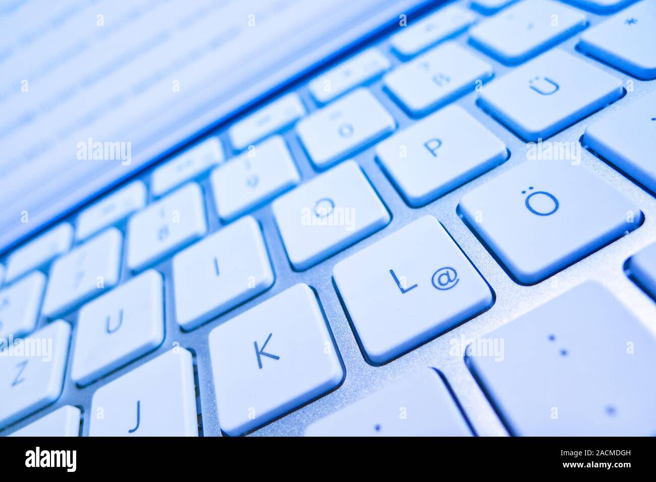Keyboard of a computer in front of screen Stock Photo - Alamy