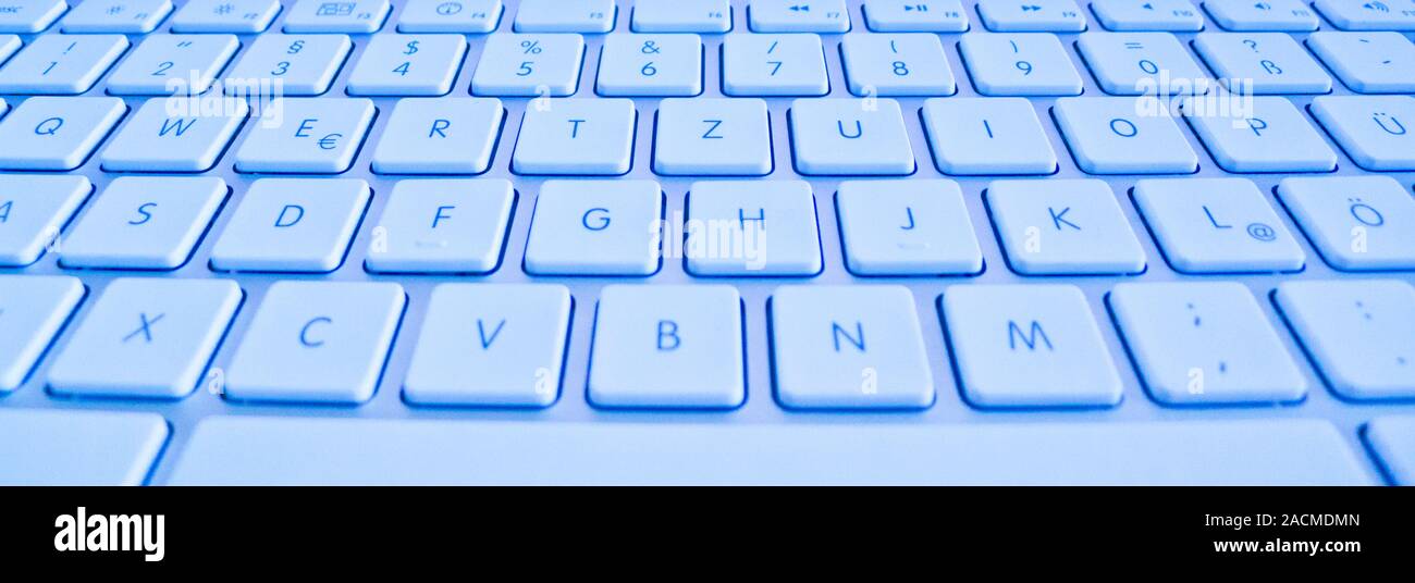 Keyboard of a computer in front of screen Stock Photo - Alamy