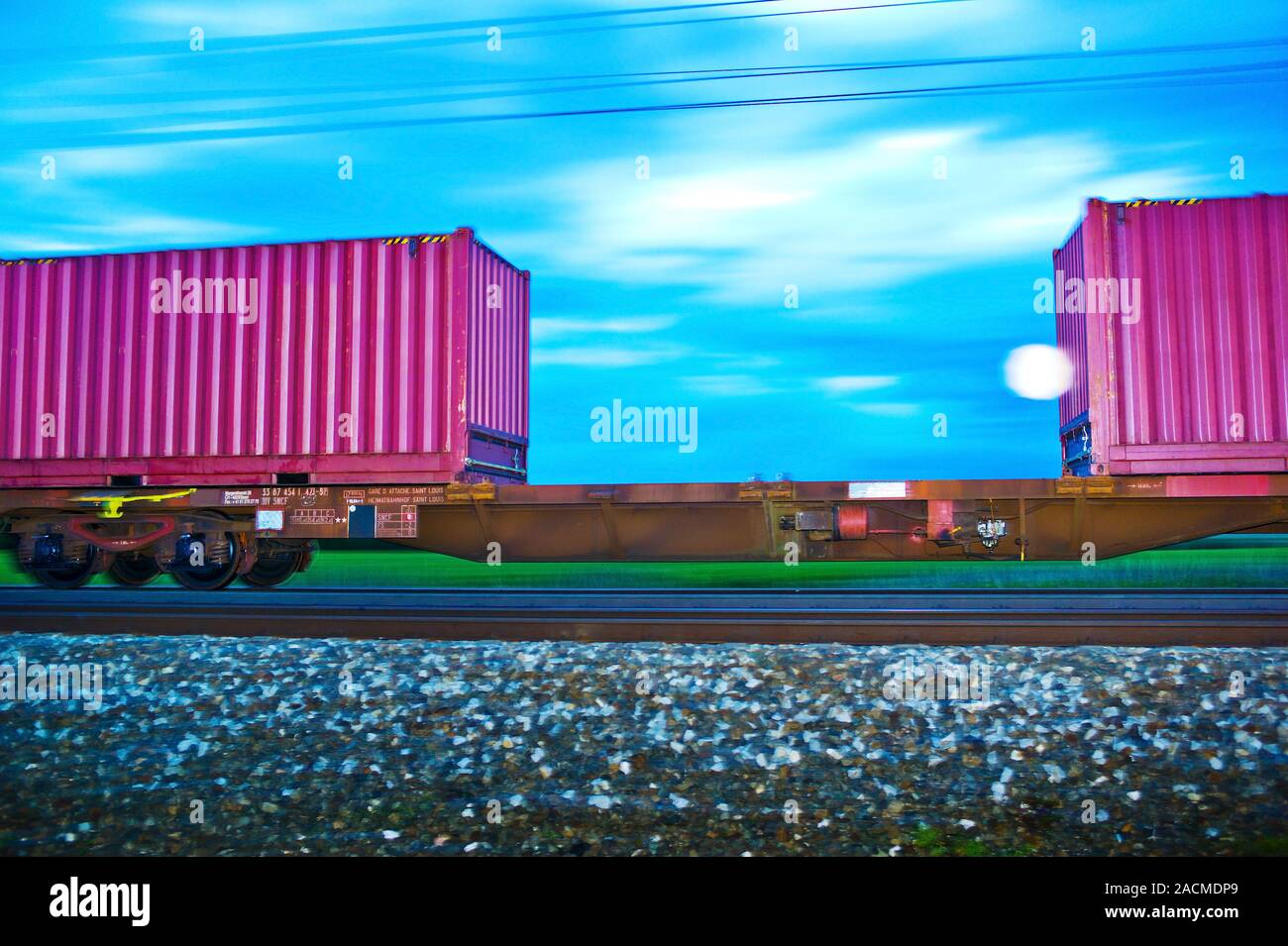 Freight train at night. night train Stock Photo - Alamy