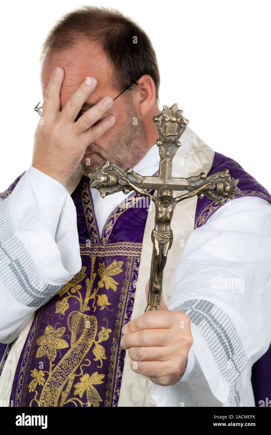 Catholic priest desperate Stock Photo - Alamy