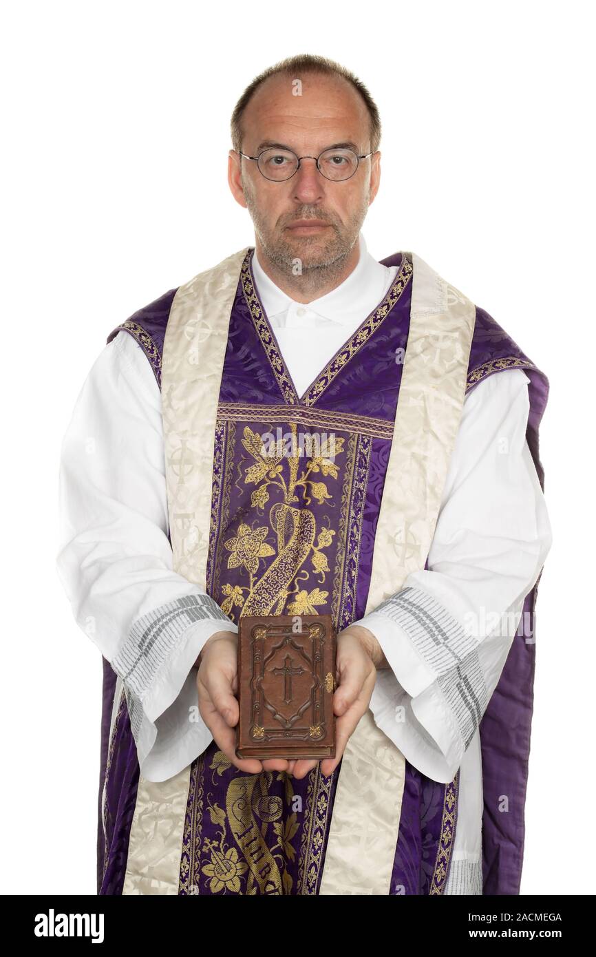 catholic priest with bible in church service Stock Photo - Alamy