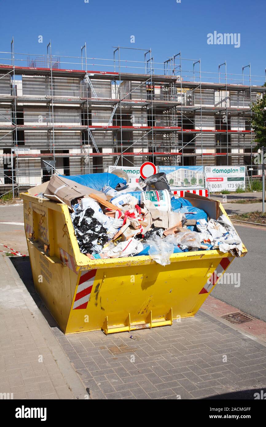 Yellow settling trough for building rubble in front of a shell, Bremen ...