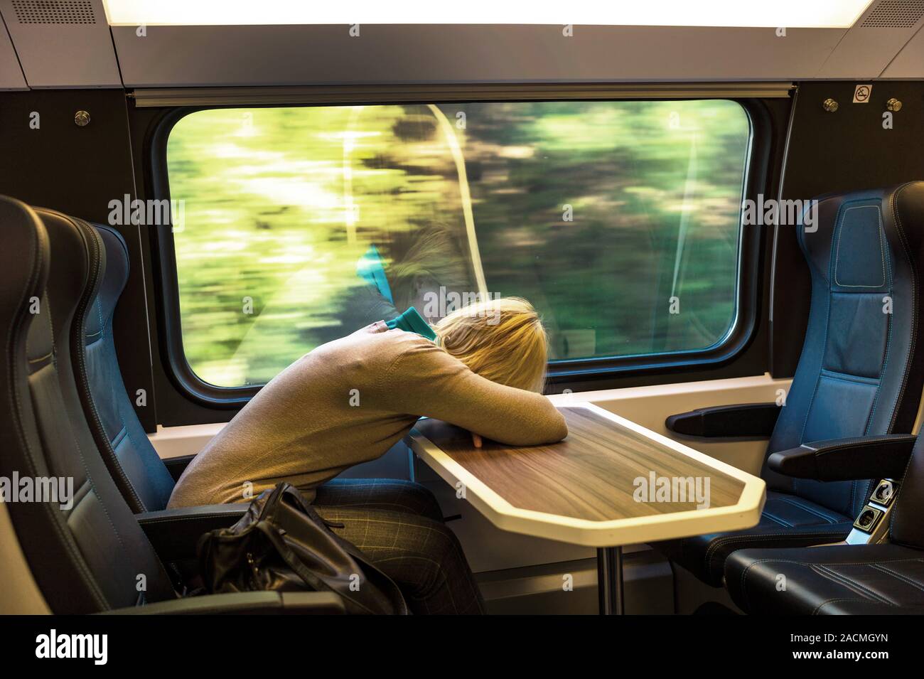 sleeping woman in a train Stock Photo - Alamy