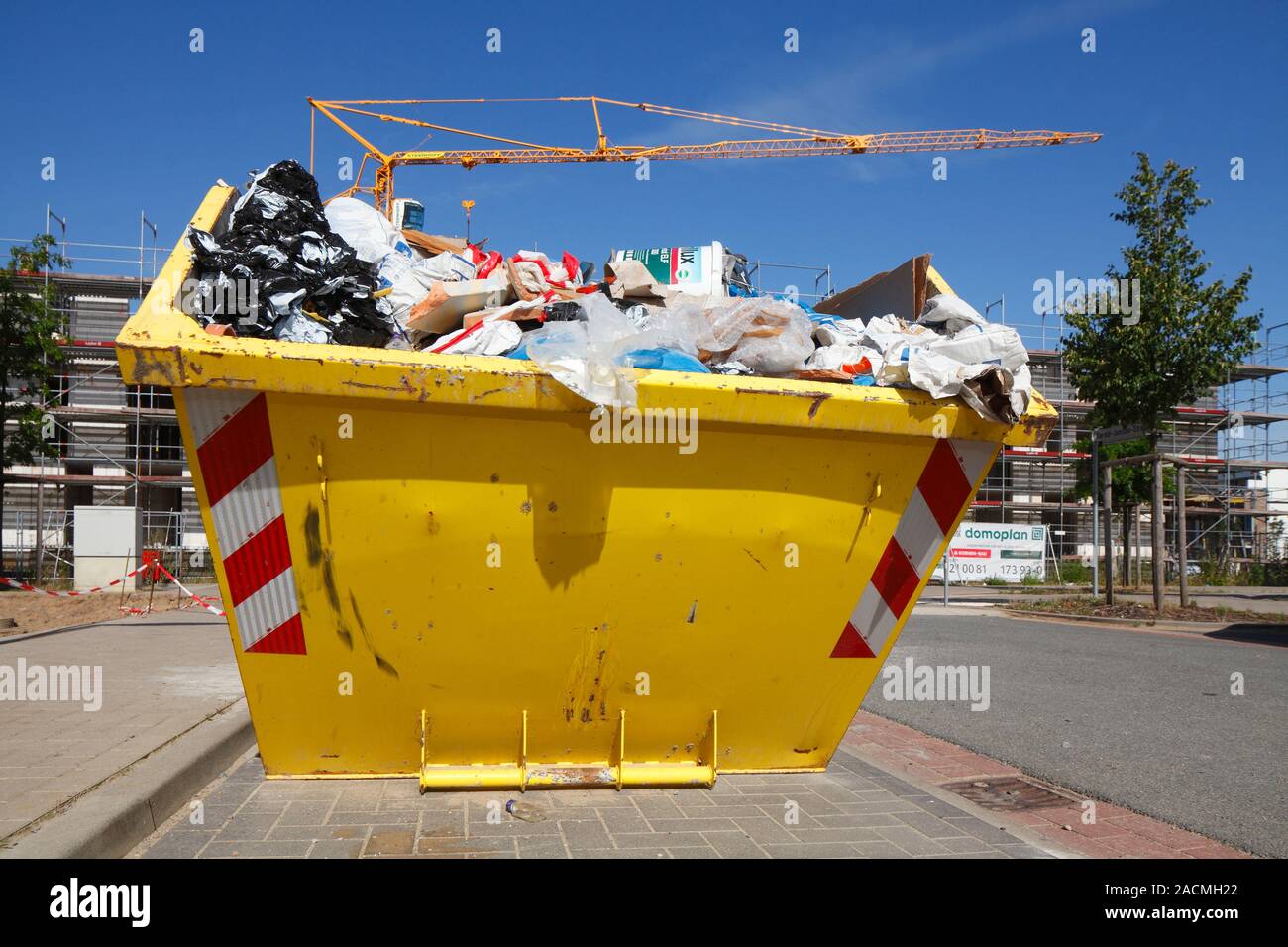 Yellow settling trough for building rubble in front of a shell, Bremen ...
