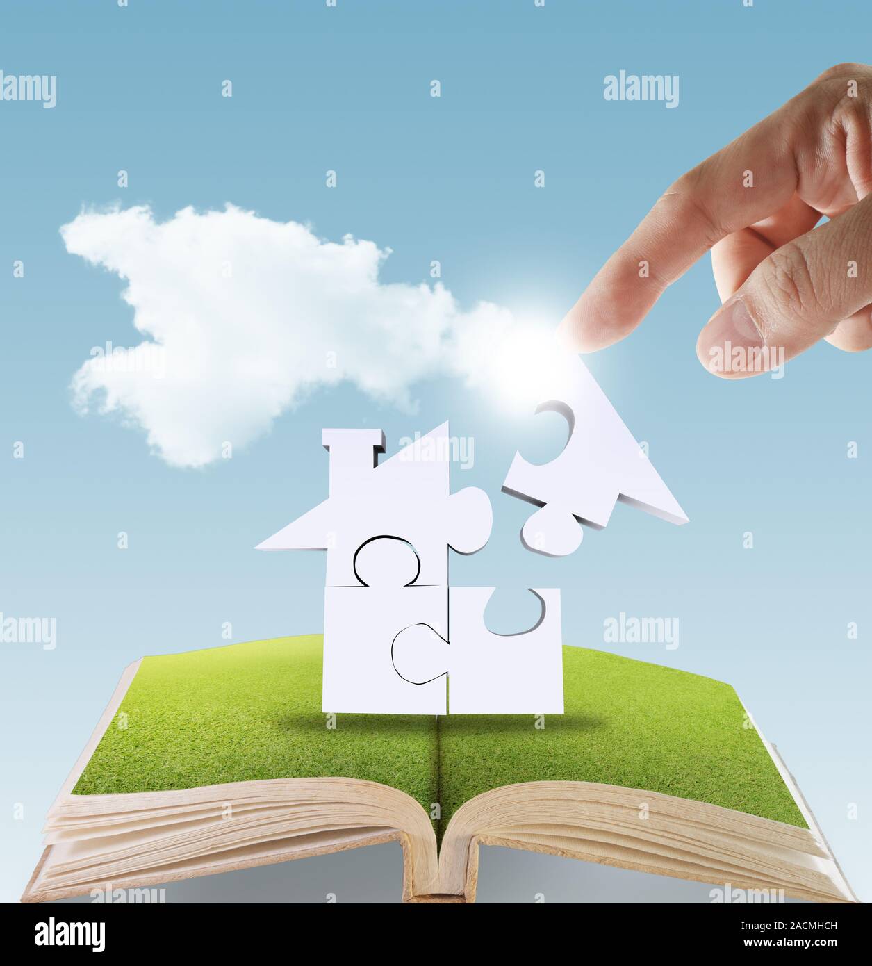 open book of hand complete puzzle home Stock Photo - Alamy