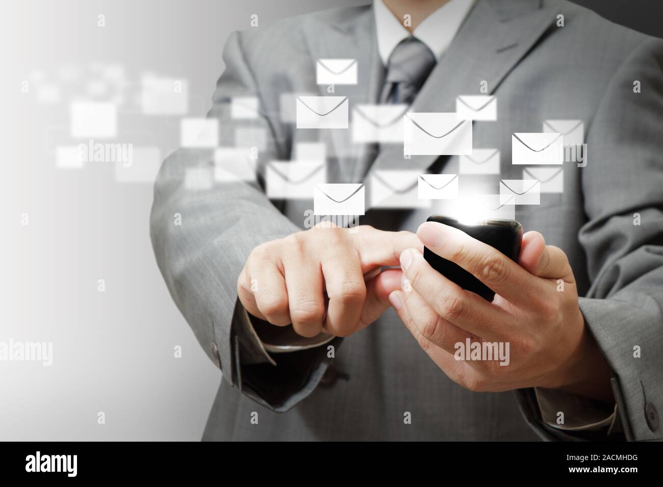 Business man hand hold Touch screen mobile phone and buttons e-mail ...